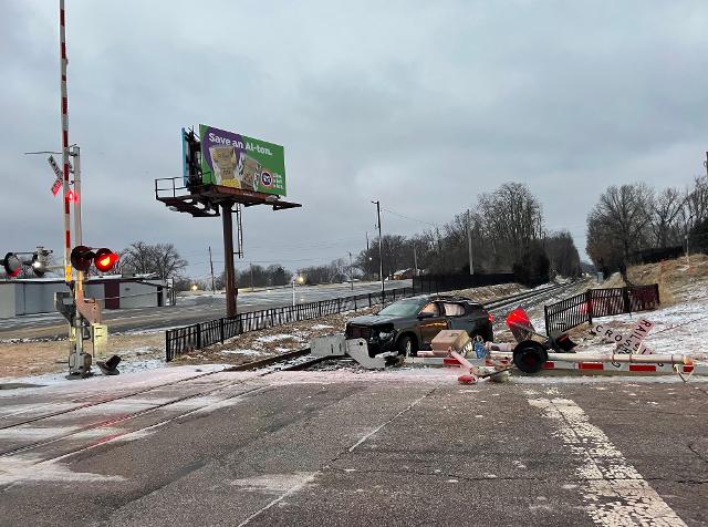 Vehicle Loses Control On Ice, Strikes Rail Arms, Gates | EdGlenToday.com